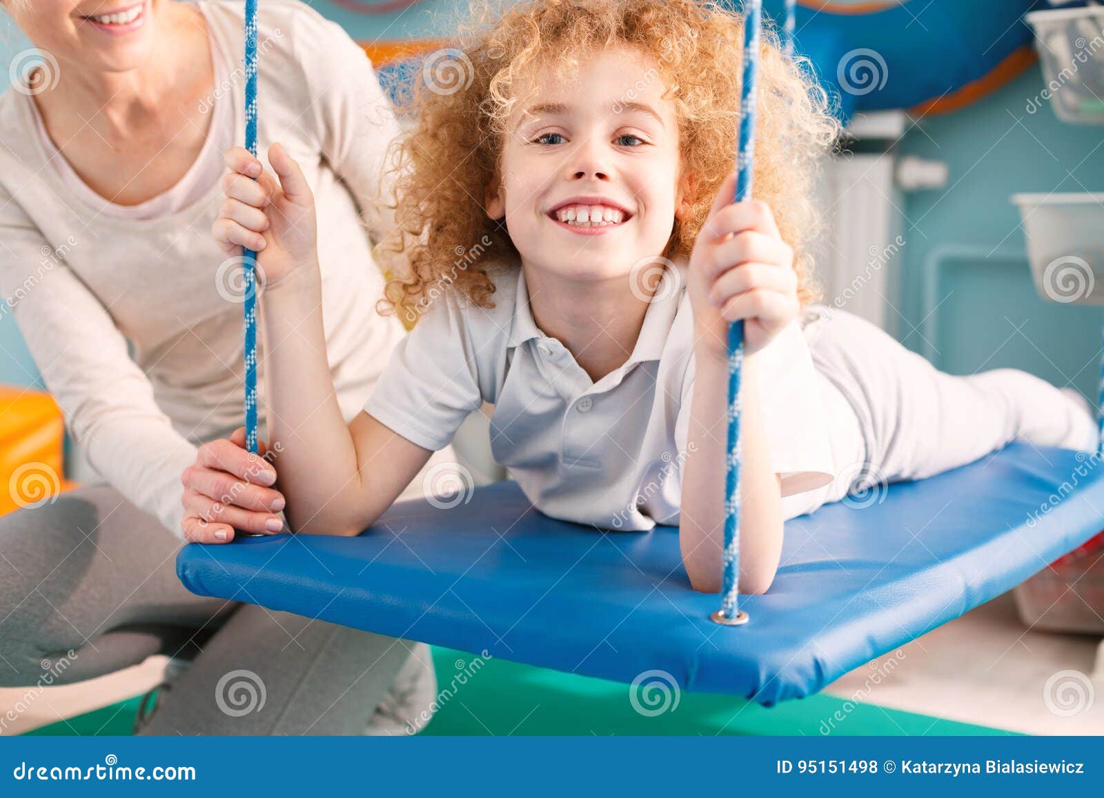 Happy boy on therapy swing stock photo. Image of equipment - 95151498