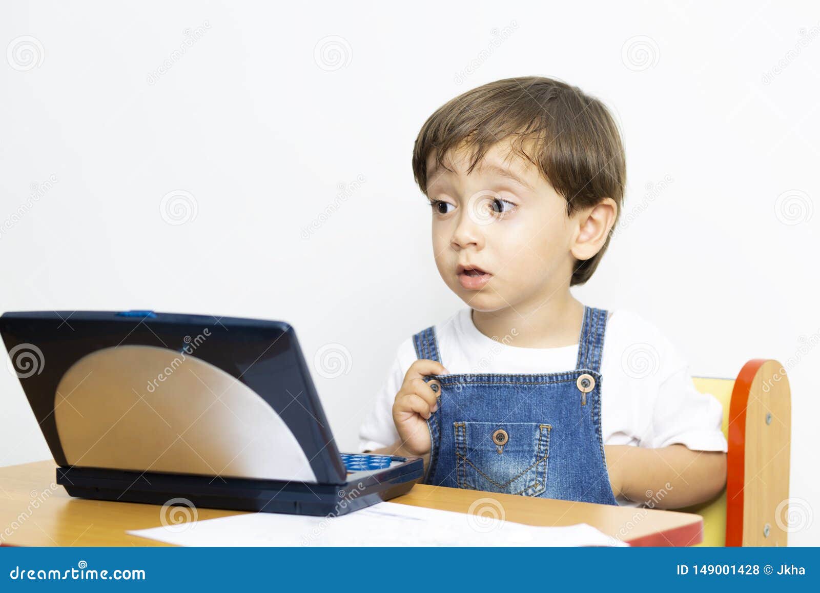 Happy Boy using laptop stock photo. Image of people - 149001428