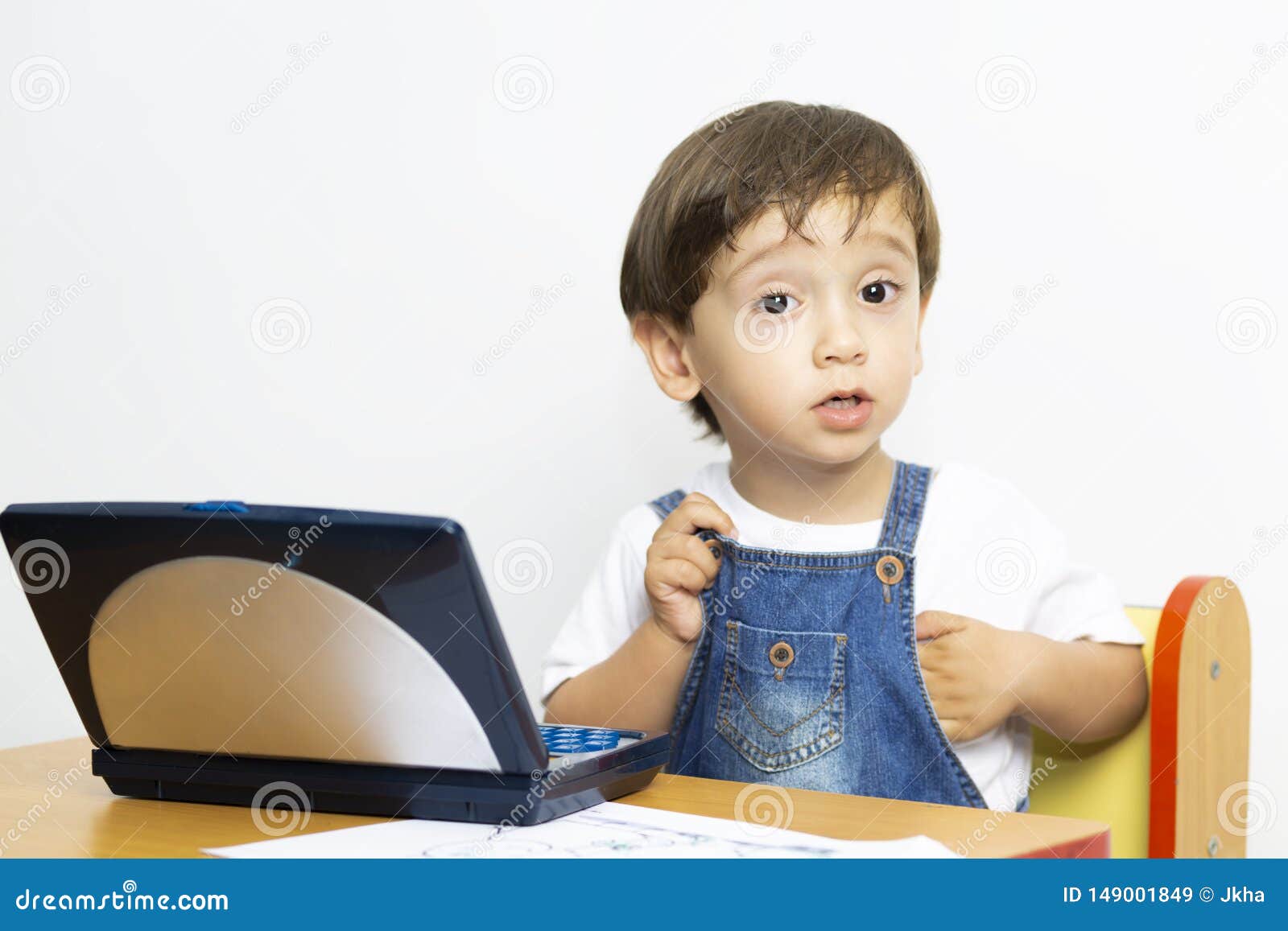 Happy Boy using laptop stock image. Image of innocence - 149001849
