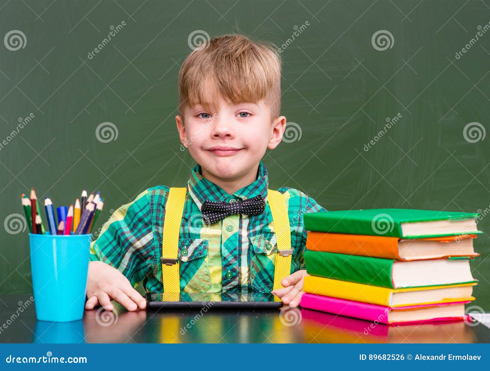 Happy Boy Using Tablet Computer in Classroom Stock Photo - Image of ...