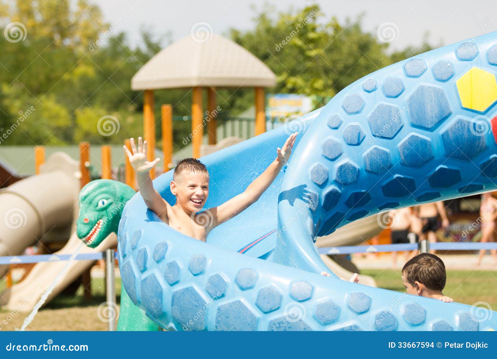 Happy boy on water slide stock photo. Image of pool, camping - 33667594