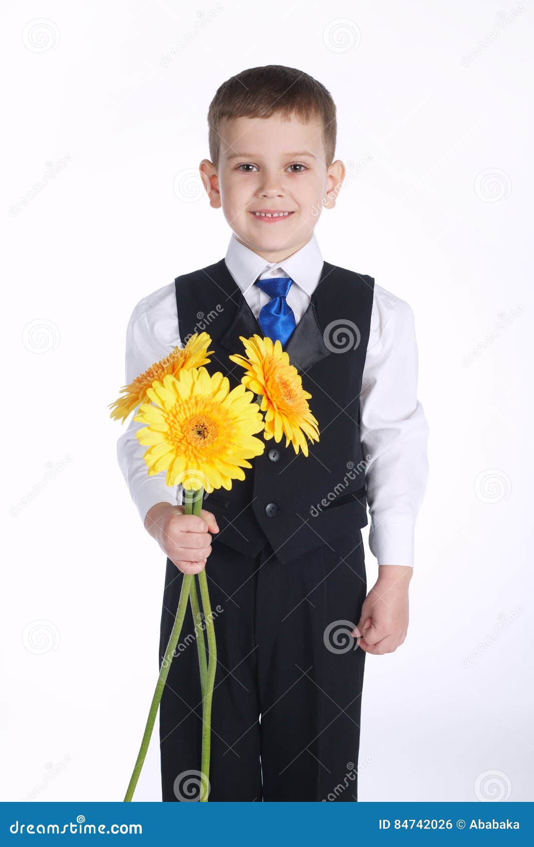 Happy Boy with Yellow Flowers Stock Photo - Image of color, happy: 84742026