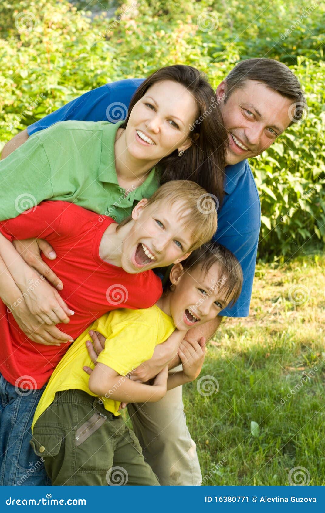 Happy boys with family stock image. Image of four, family - 16380771
