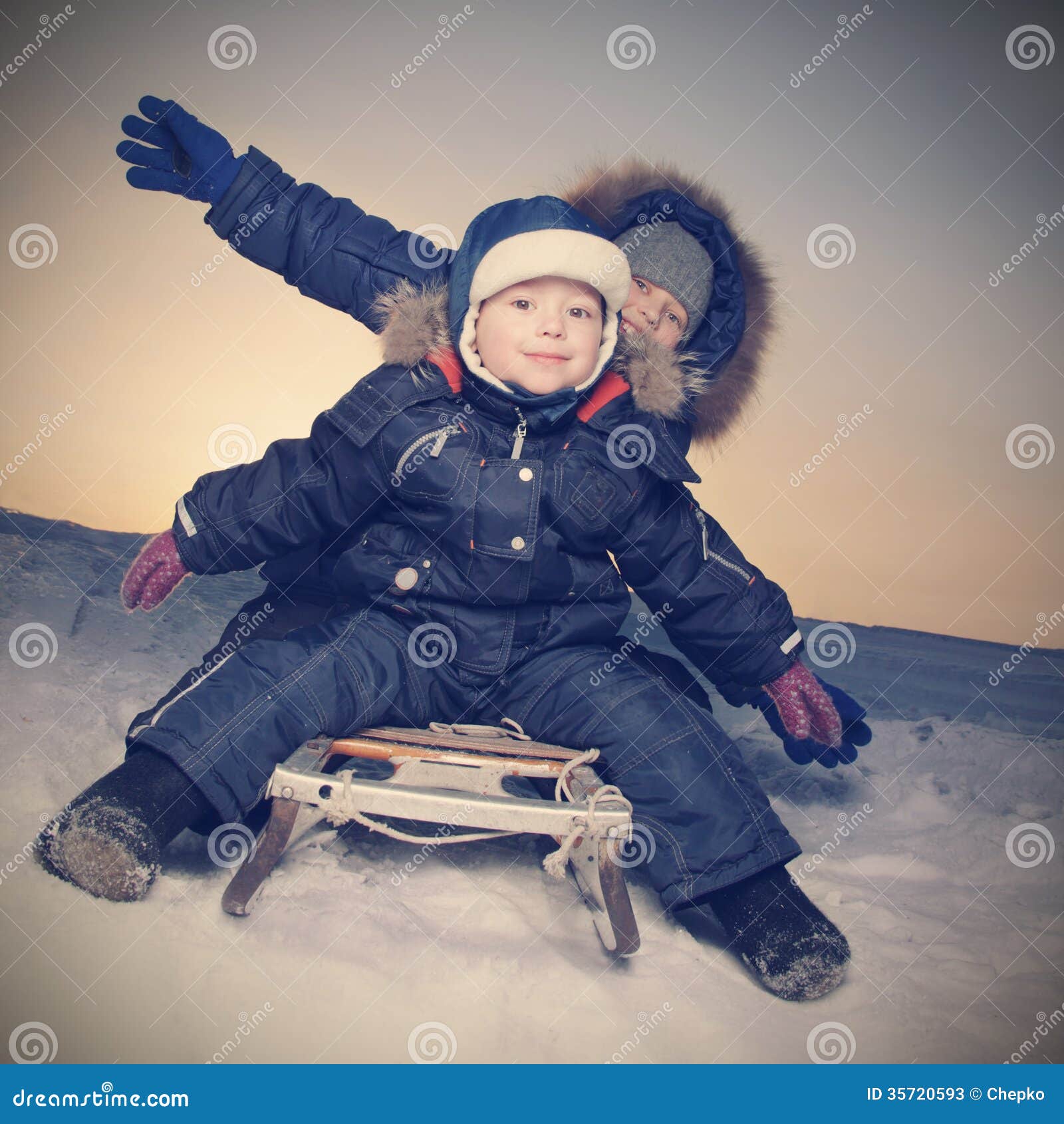 Happy boys on sled stock image. Image of childhood, cold - 35720593
