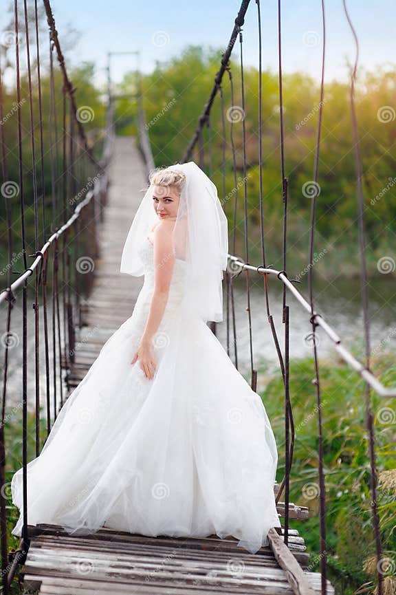 Happy bride on the bridge stock photo. Image of model - 50104934