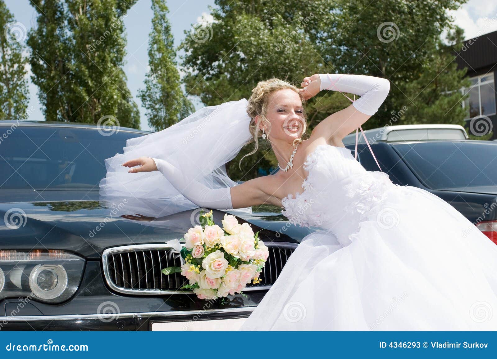 A happy bride by a car stock image. Image of clothing - 4346293