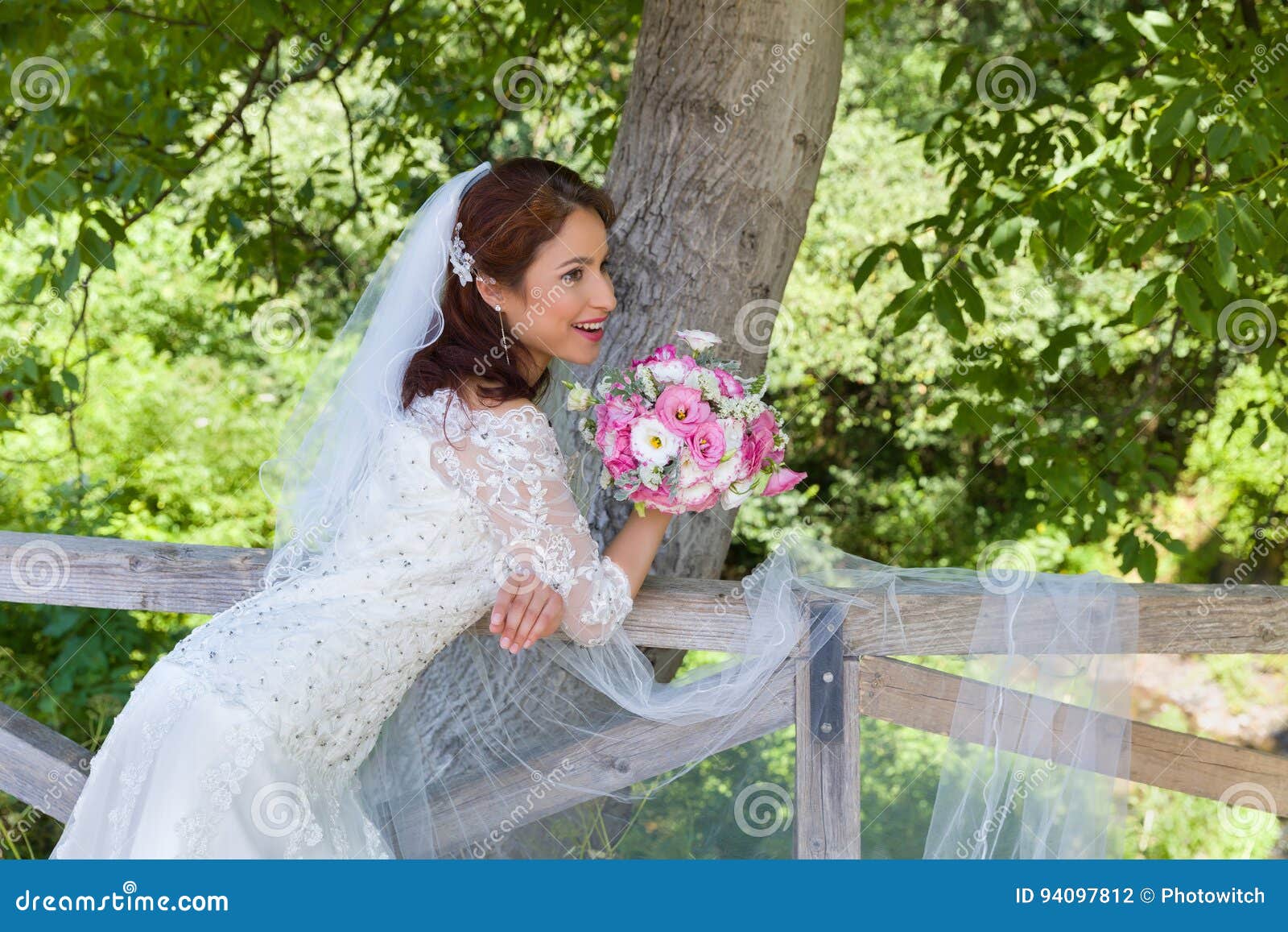 Happy bride in garden stock photo. Image of laughing - 94097812
