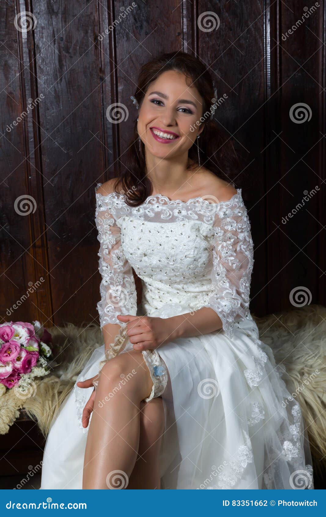 Happy bride with garter stock photo. Image of wedding - 83351662