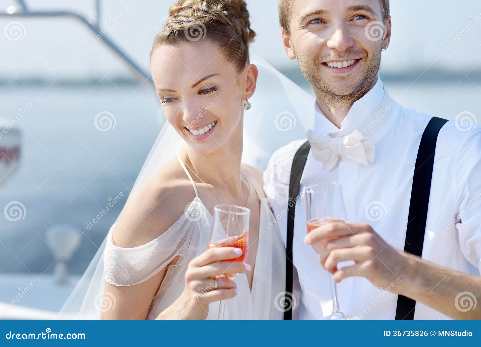 Happy Bride and Groom Drinking Champagne Stock Photo - Image of marine ...