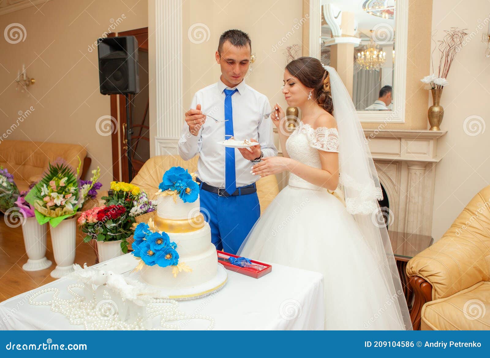 Bride and Groom Eat Wedding Cake Stock Photo - Image of beautiful ...