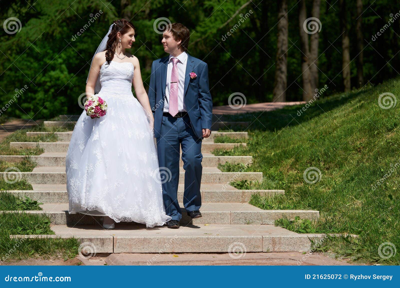 Happy Bride and Groom at Wedding Walk Stock Photo - Image of fence ...