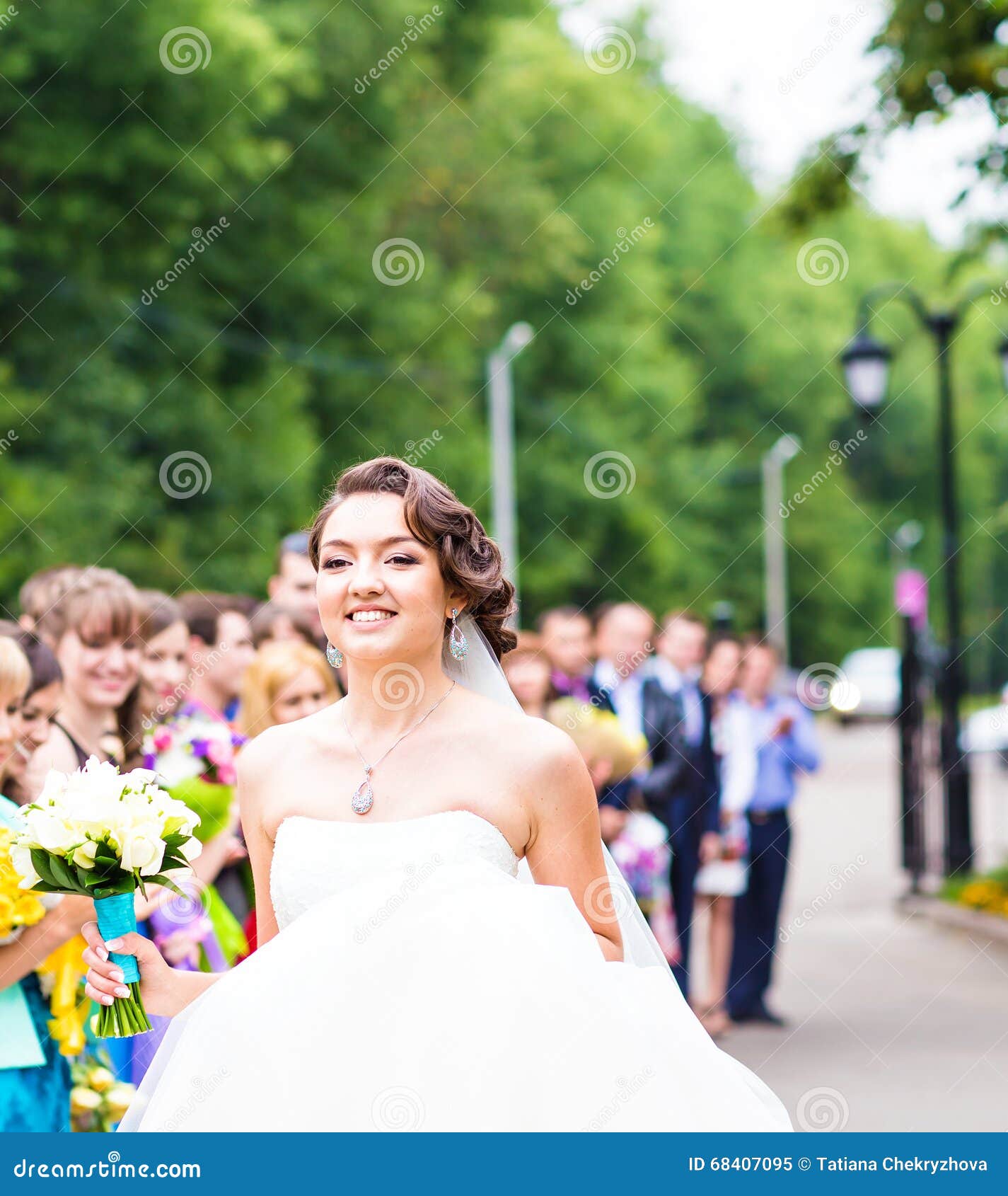 Happy bride with guests stock image. Image of bridal - 68407095