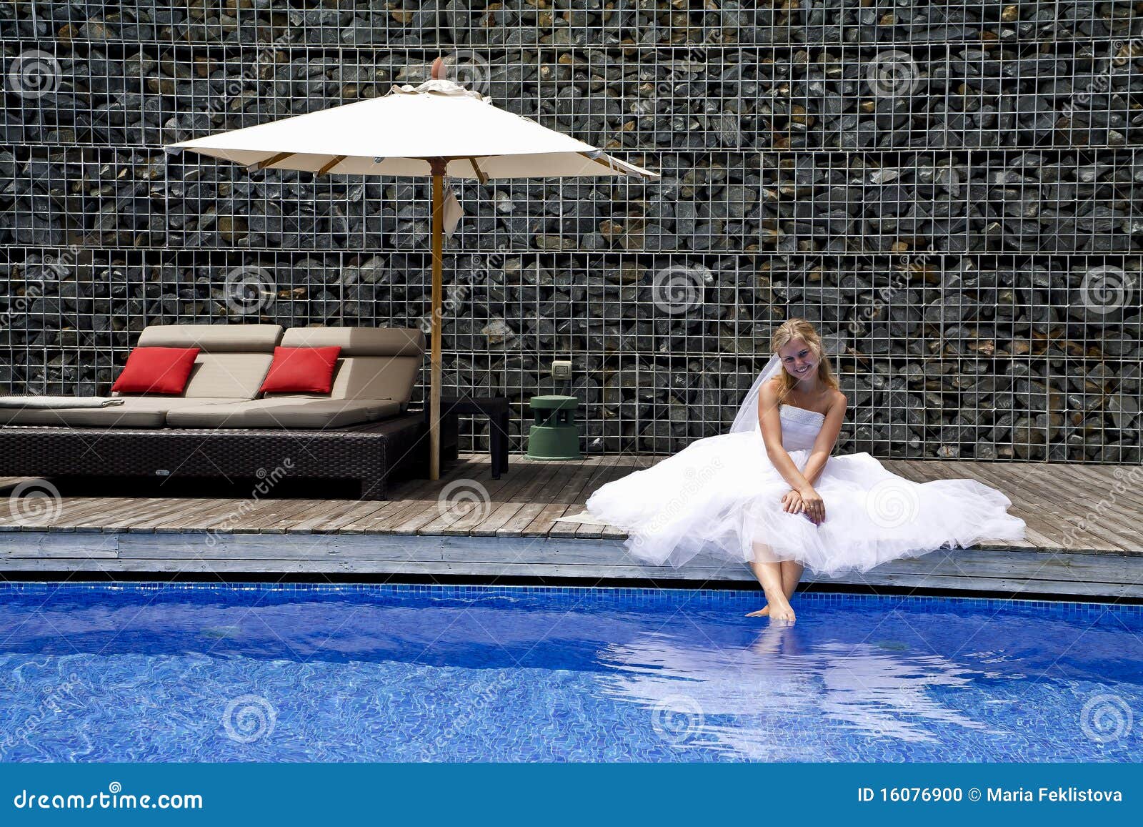 Happy bride near a pool stock photo. Image of hope, bride - 16076900