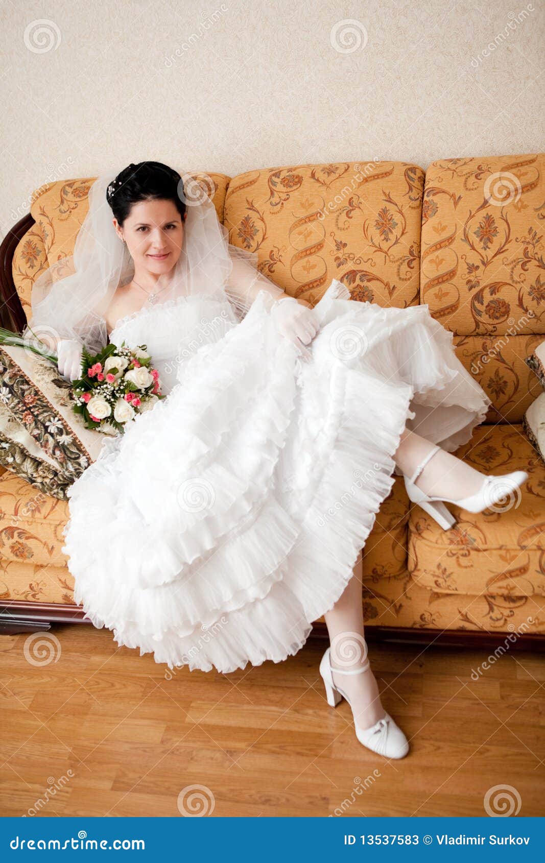Happy bride on the sofa stock image. Image of portrait - 13537583