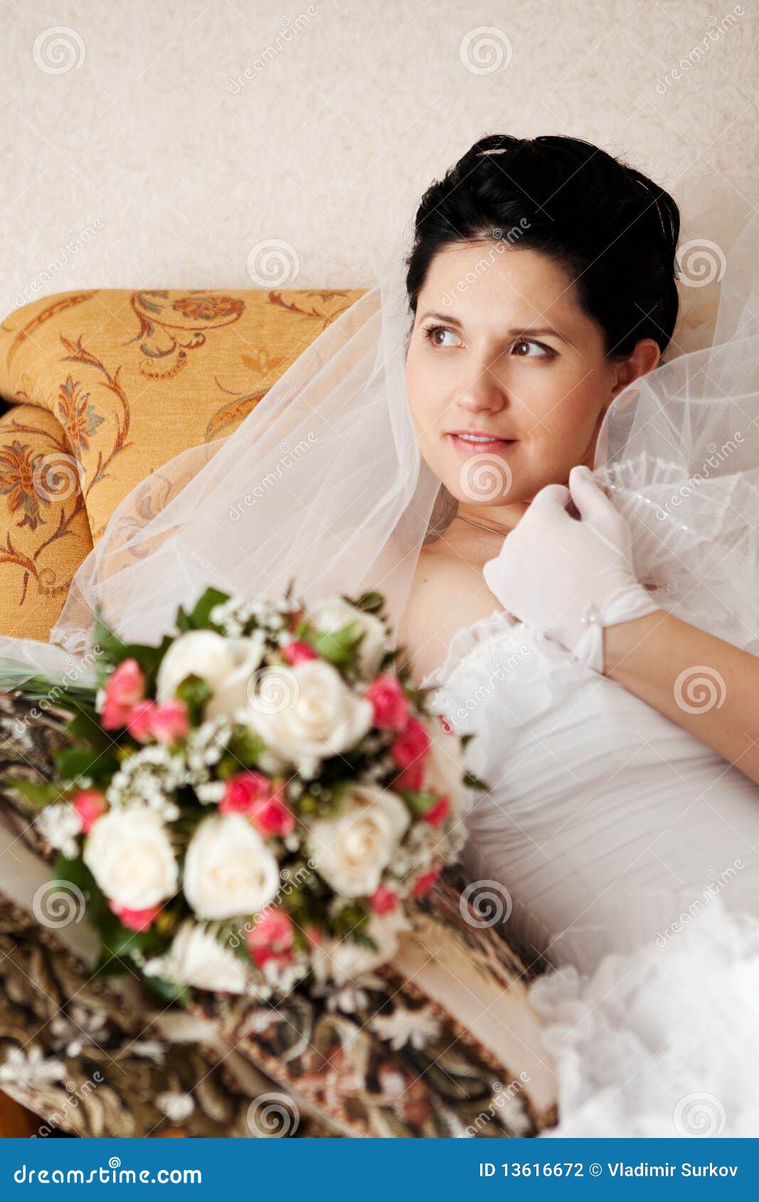 Happy bride on the sofa stock photo. Image of cute, dress - 13616672
