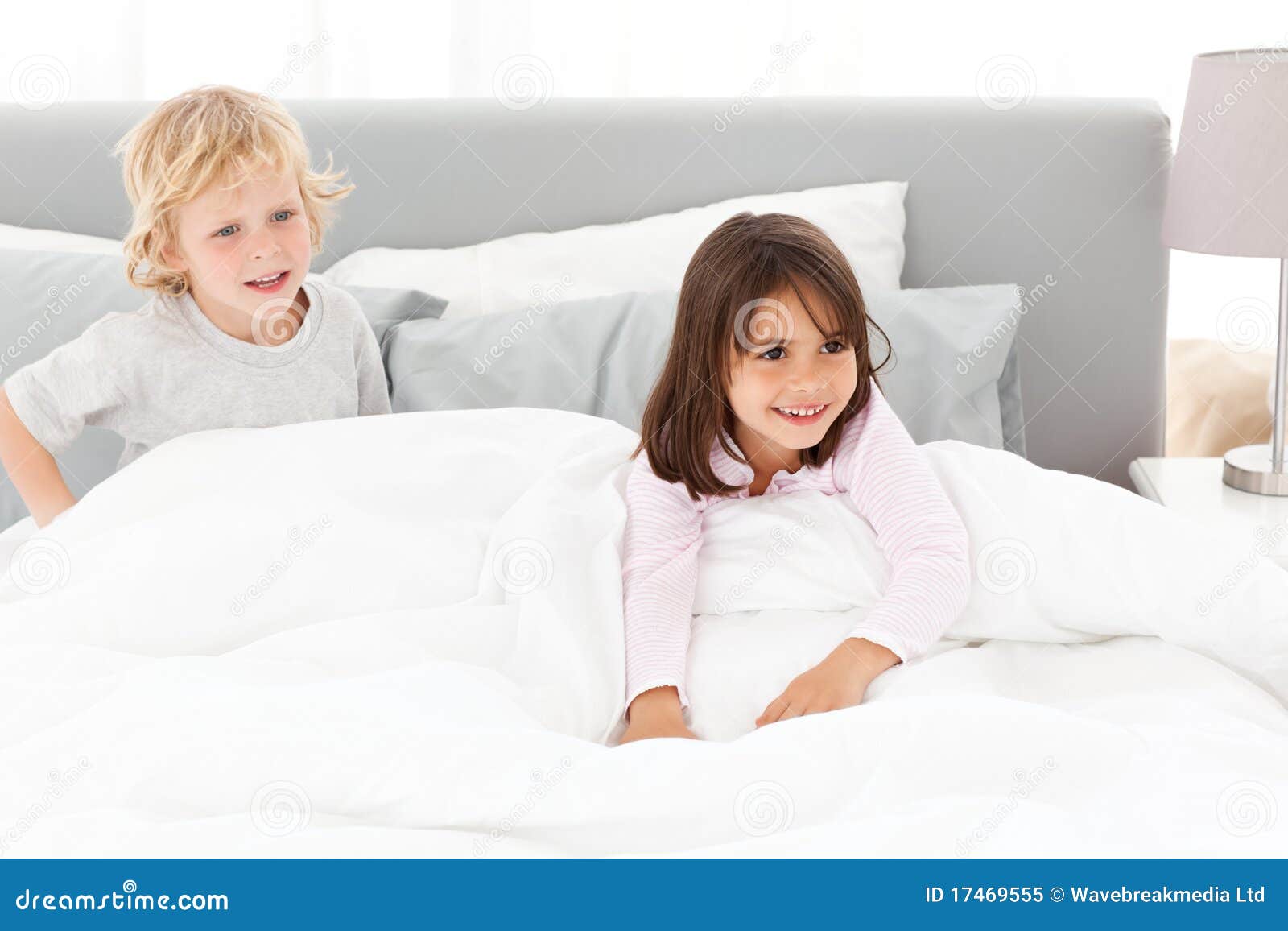 Happy Brother With Little Brother Lying In A Bed Together, Kissing And ...