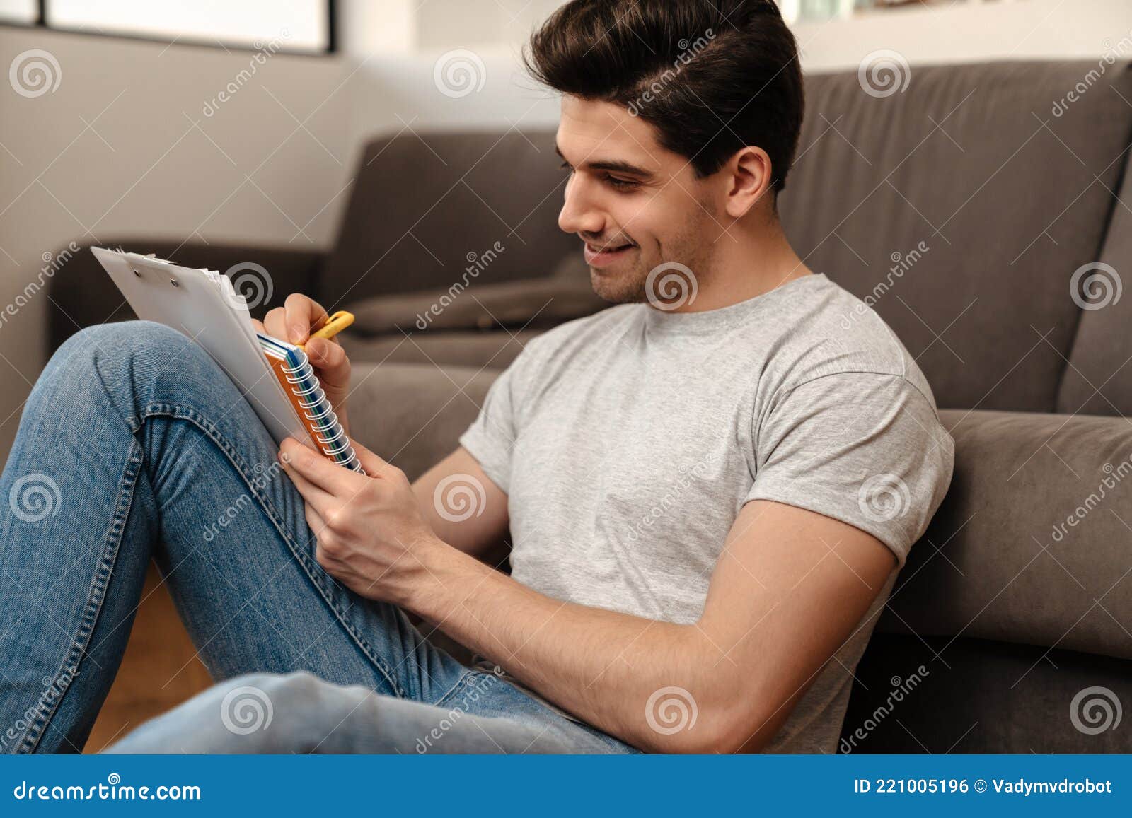 Happy Brunette Guy Writing Down Notes Stock Photo - Image of exercise ...