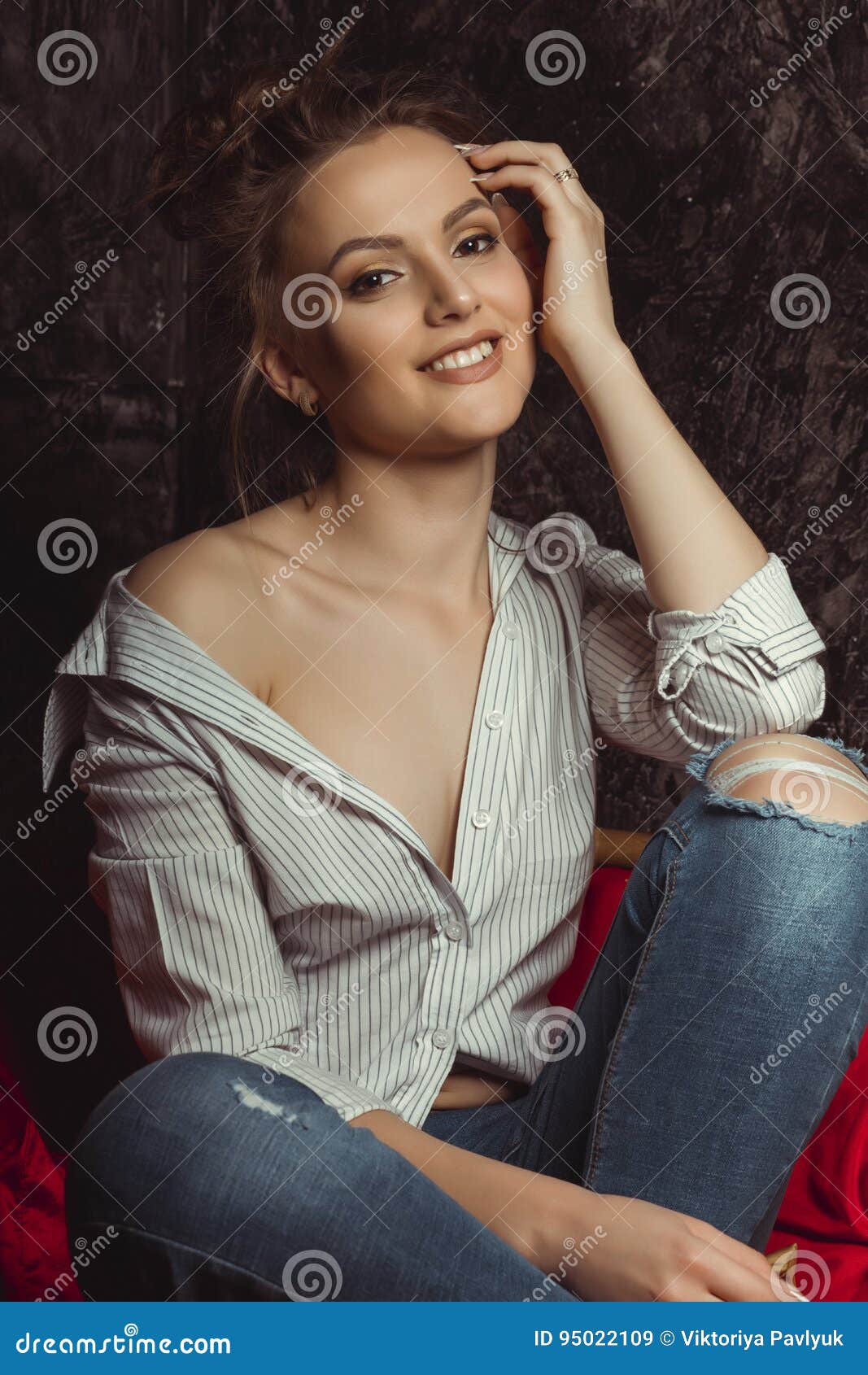 Happy Brunette Model With Natural Makeup In Shirt And Torn Jeans Stock