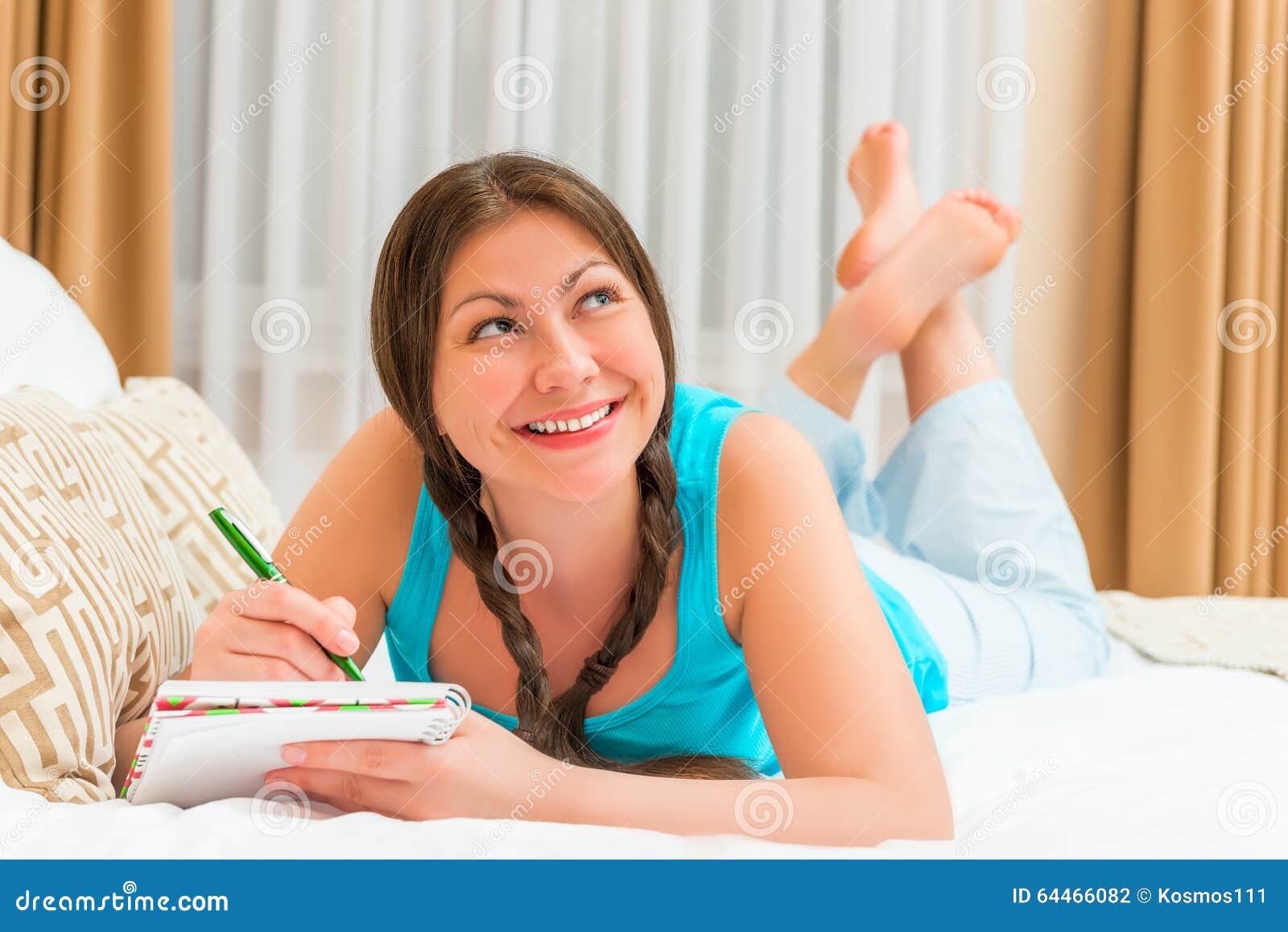 Happy Brunette Takes Notes in a Notebook Stock Photo - Image of cute ...