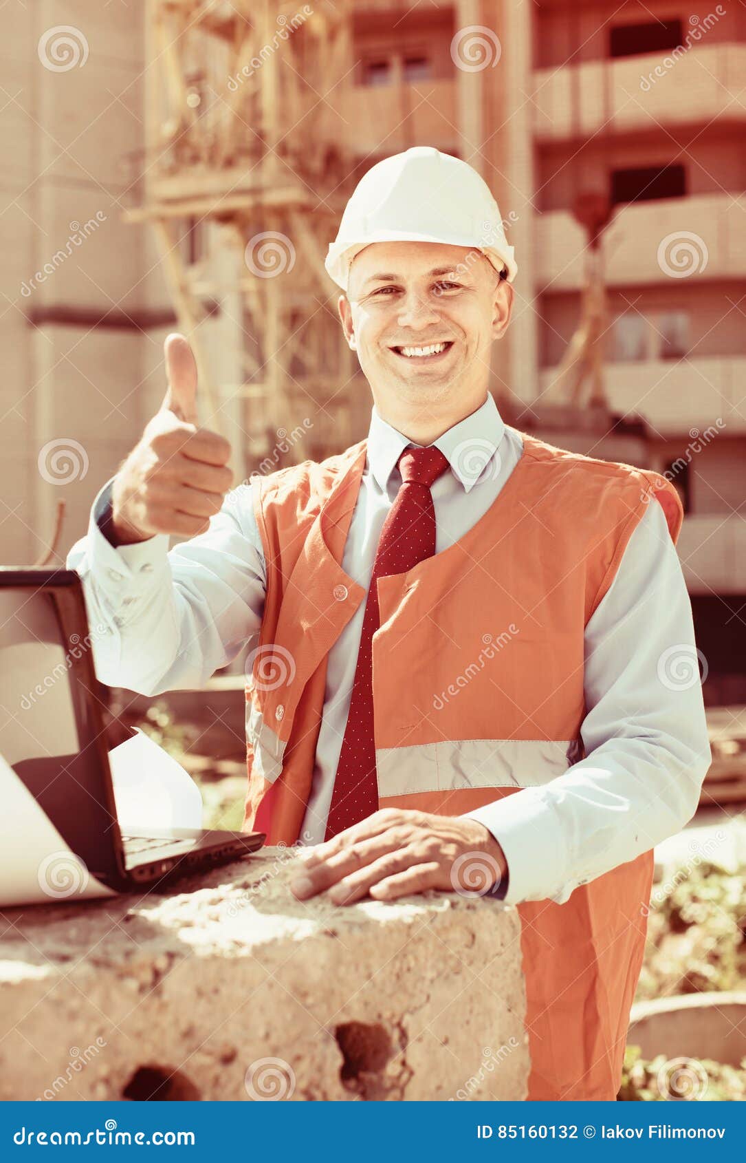 Happy Builder in Building Site Stock Photo - Image of laptop, device ...