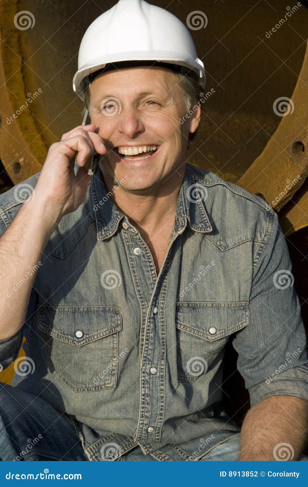 Happy builder on cellphone stock photo. Image of happy - 8913852