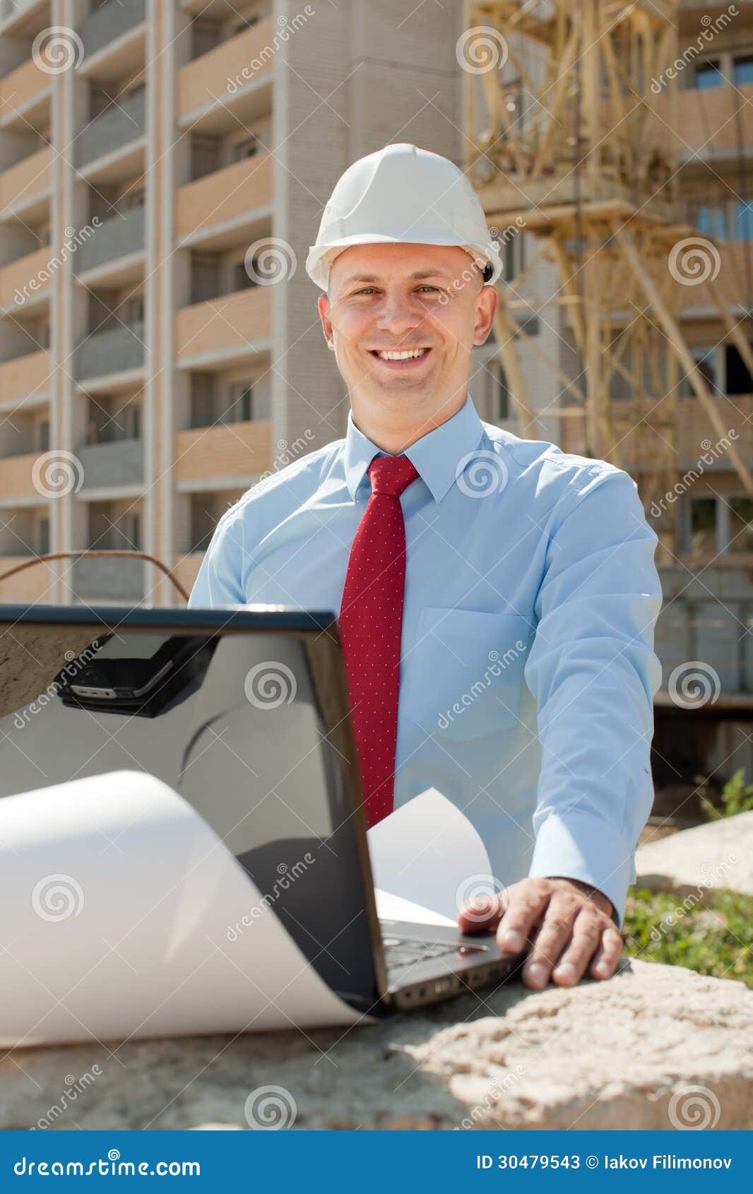 Happy builder in hardhat stock image. Image of laptop - 30479543