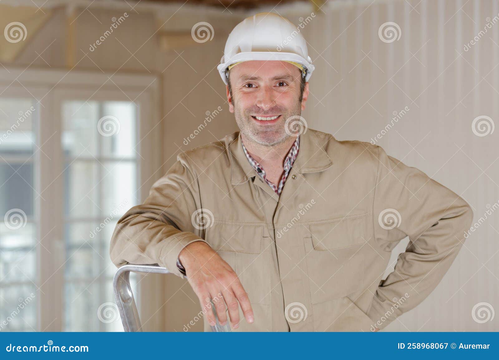Happy builder on ladder stock image. Image of tool, closeup - 258968067