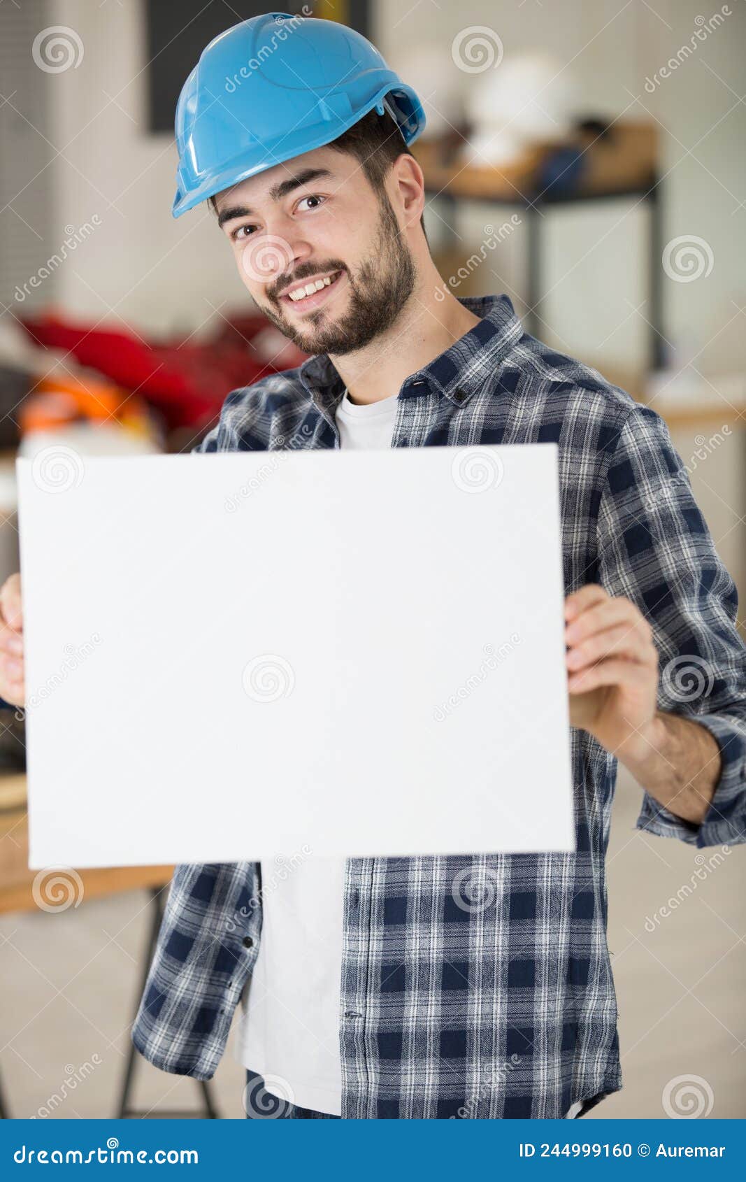 Happy Builder Looking at Camera Showing Banner Stock Photo - Image of ...