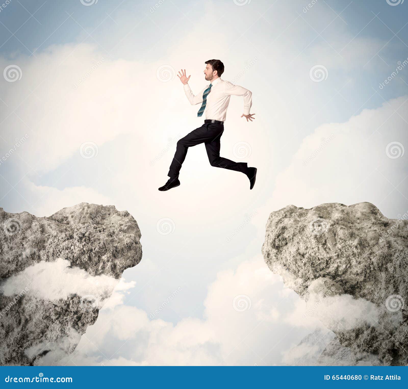Happy Business Man Jumping Over a Cliff Stock Photo - Image of ...