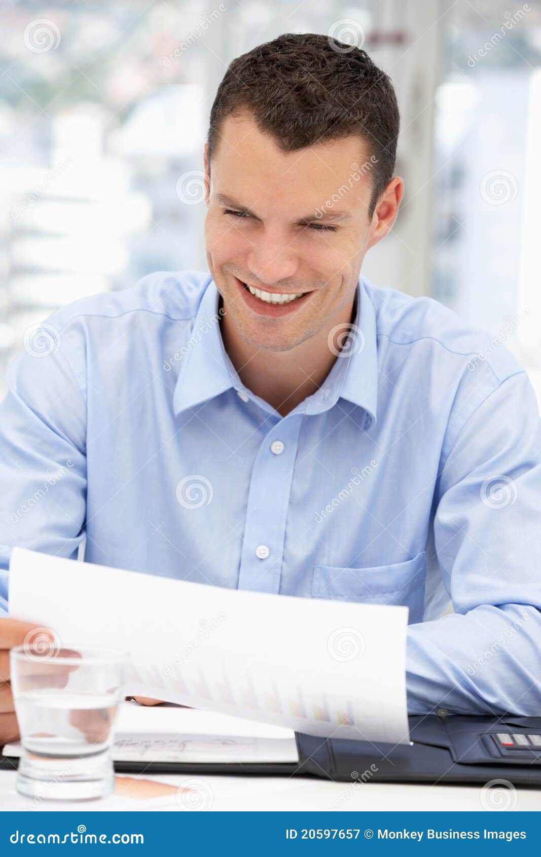 Happy Business Man Reading Notes in Office Stock Image - Image of young ...
