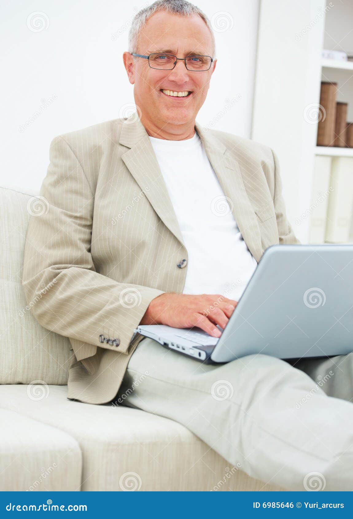 Happy Business Man Using a Laptop at Home Stock Photo - Image of adult ...