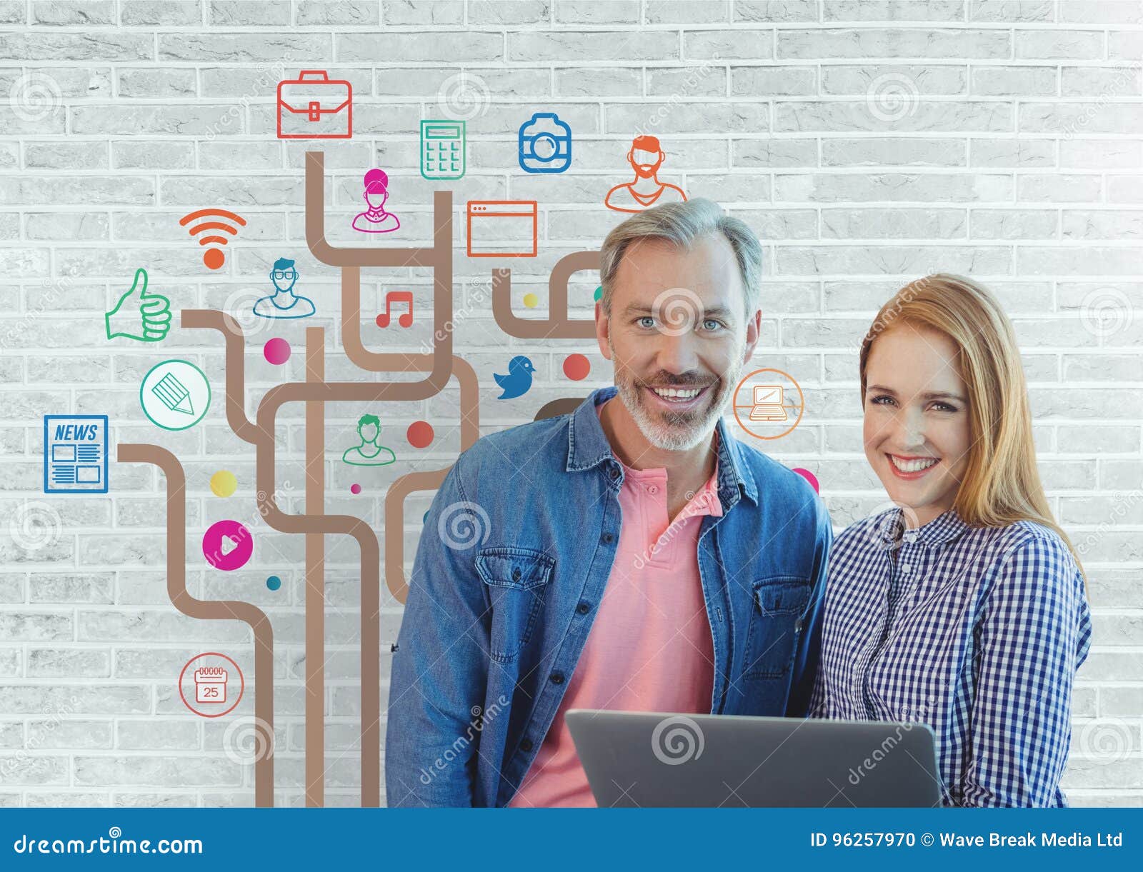 Happy Business People Holding a Computer Against White Wall with ...