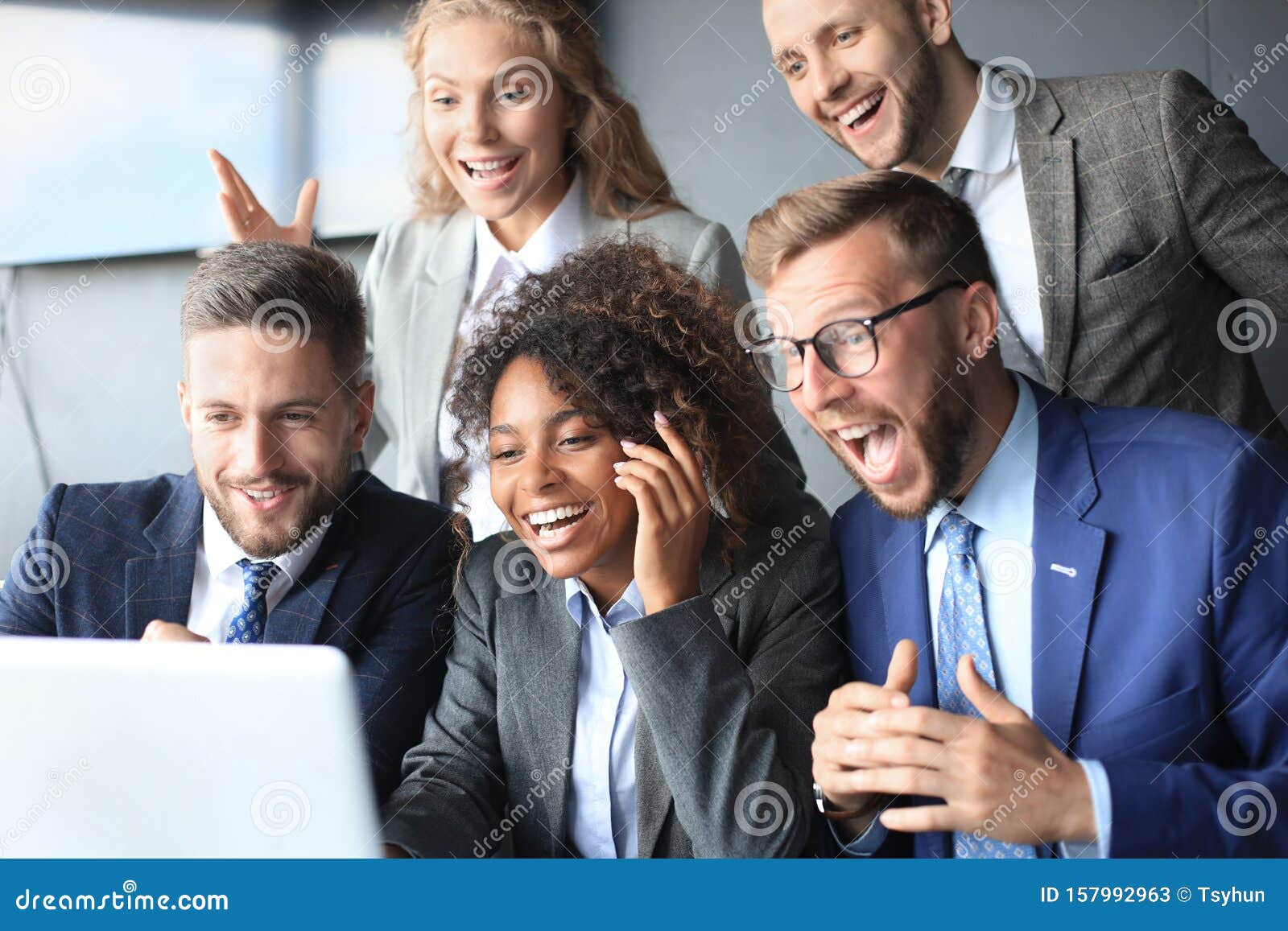 Happy Business People Laugh Near Laptop In The Office Successful Team