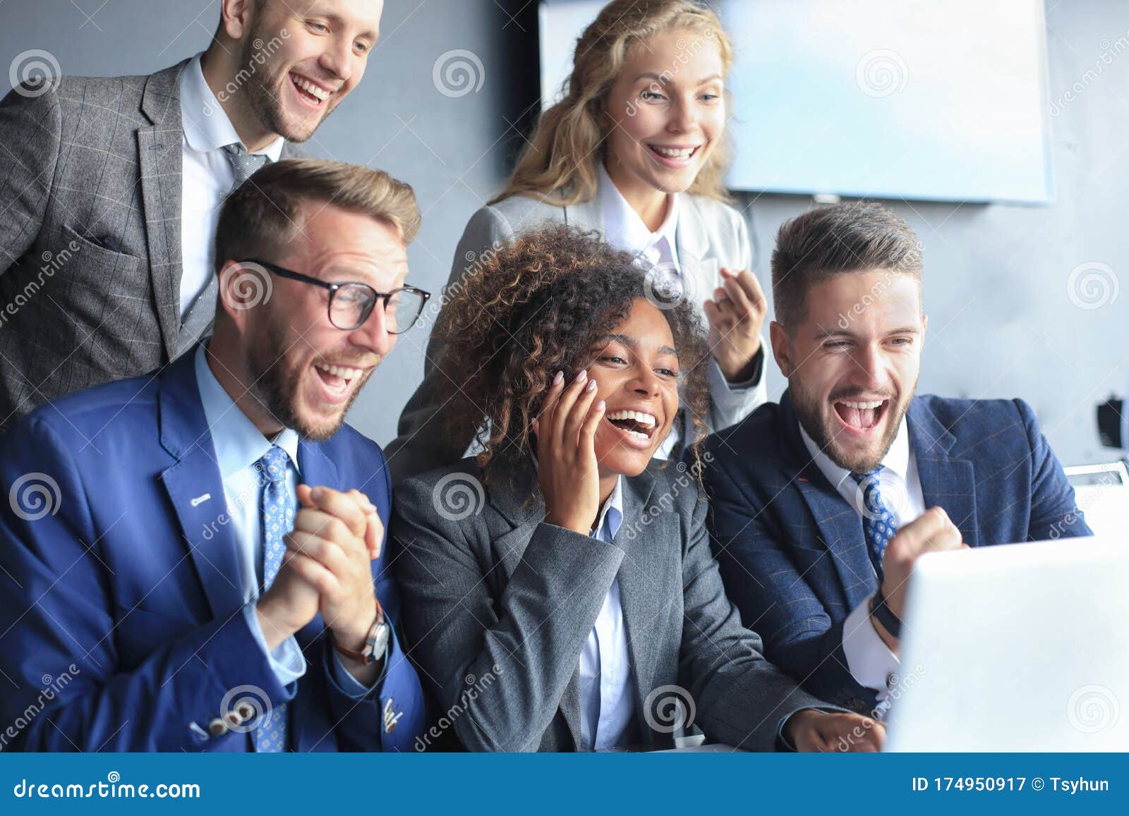 Happy Business People Laugh Near Laptop In The Office Successful Team