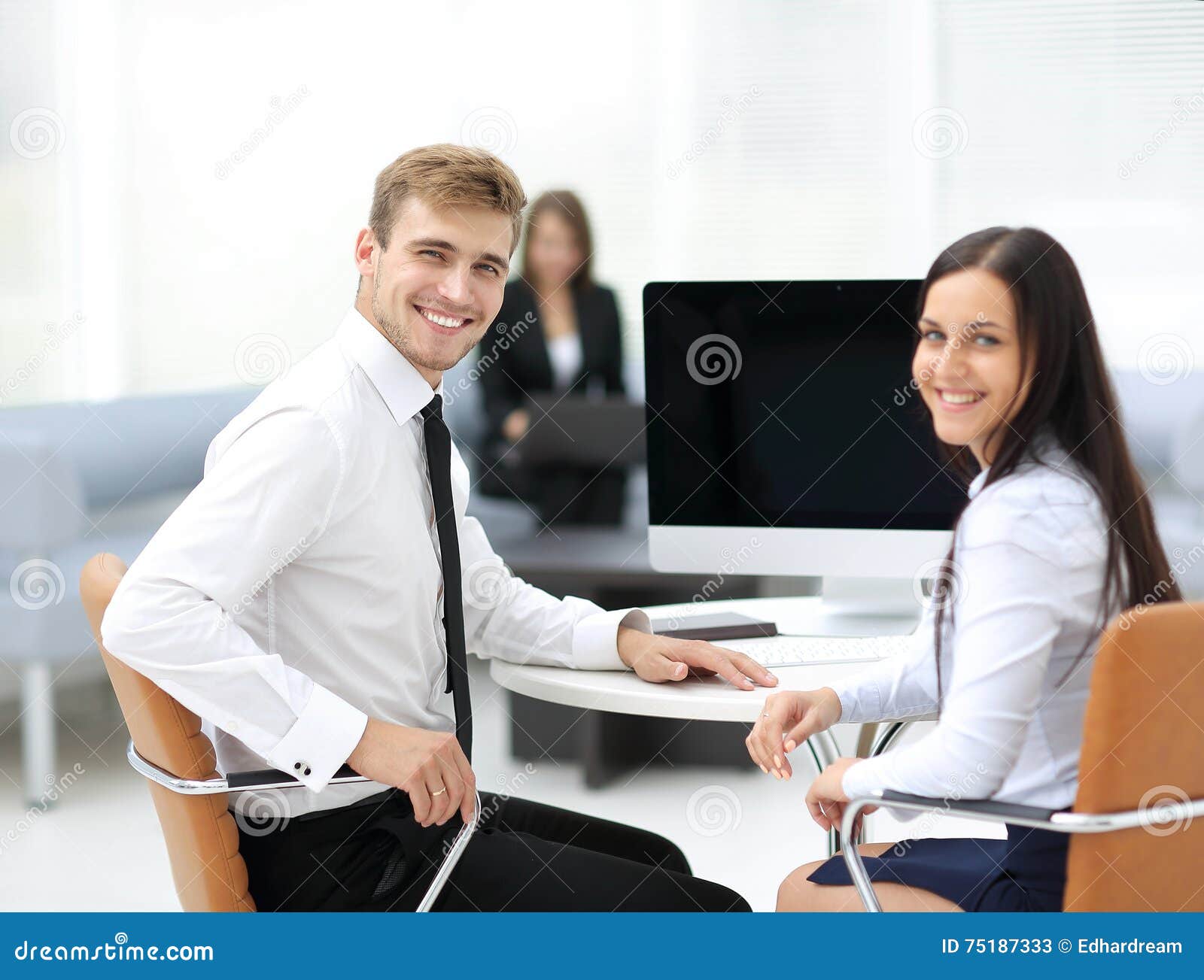 Happy Business People Looking at Camera in Office and Using Com Stock ...