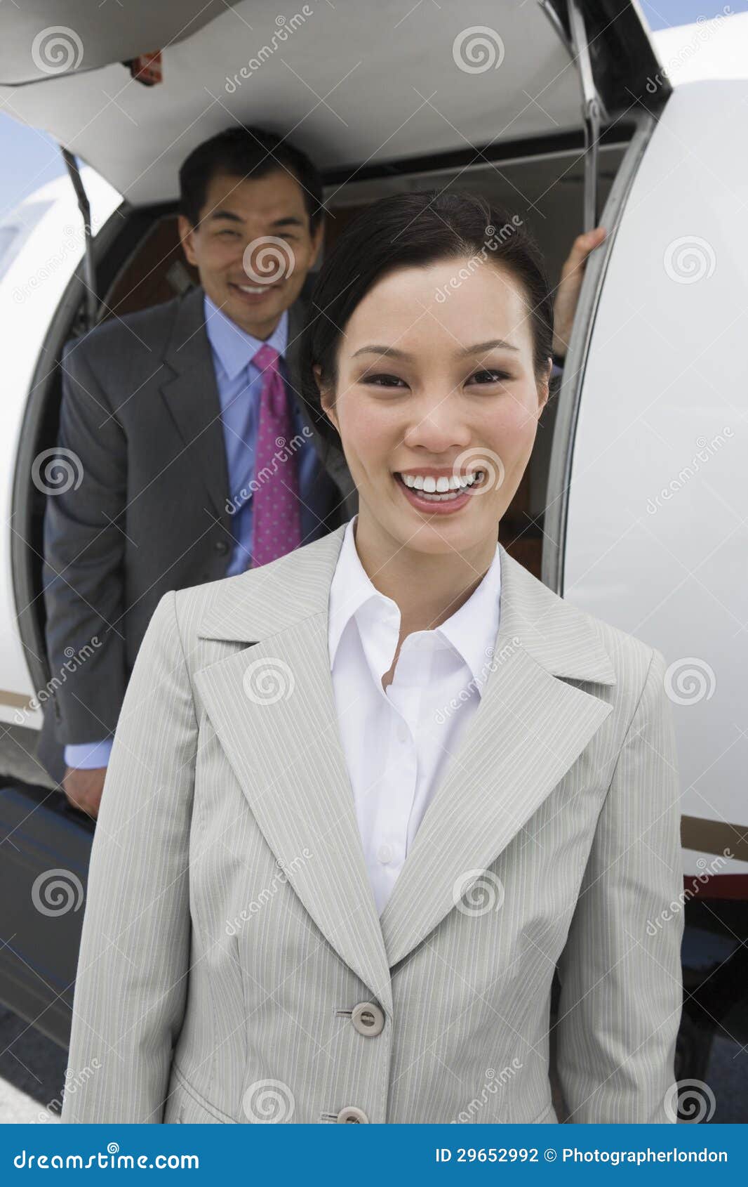 Happy Business People Standing by Airplane Stock Photo - Image of ...