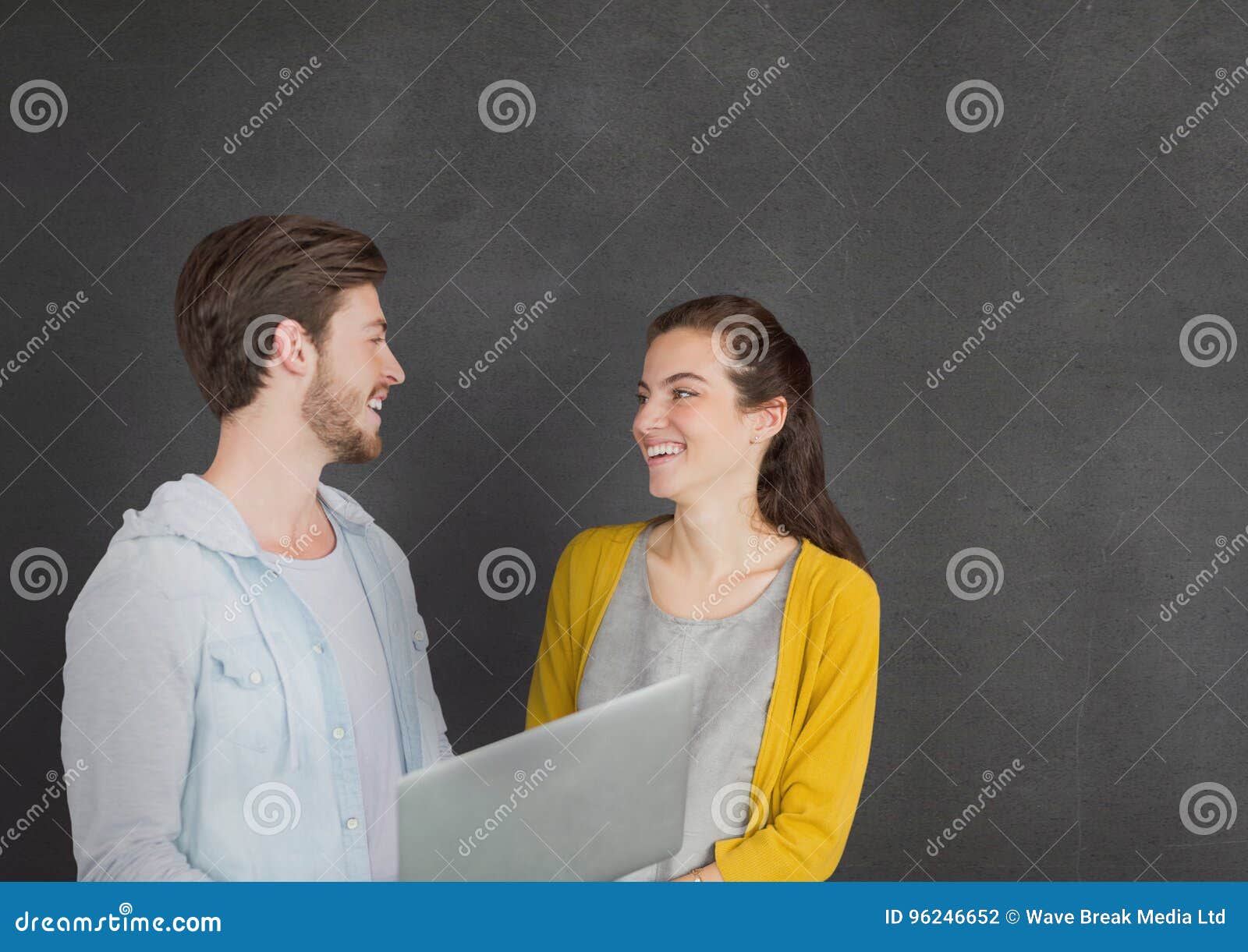 Happy Business People Talking Against Grey Background Stock Photo ...