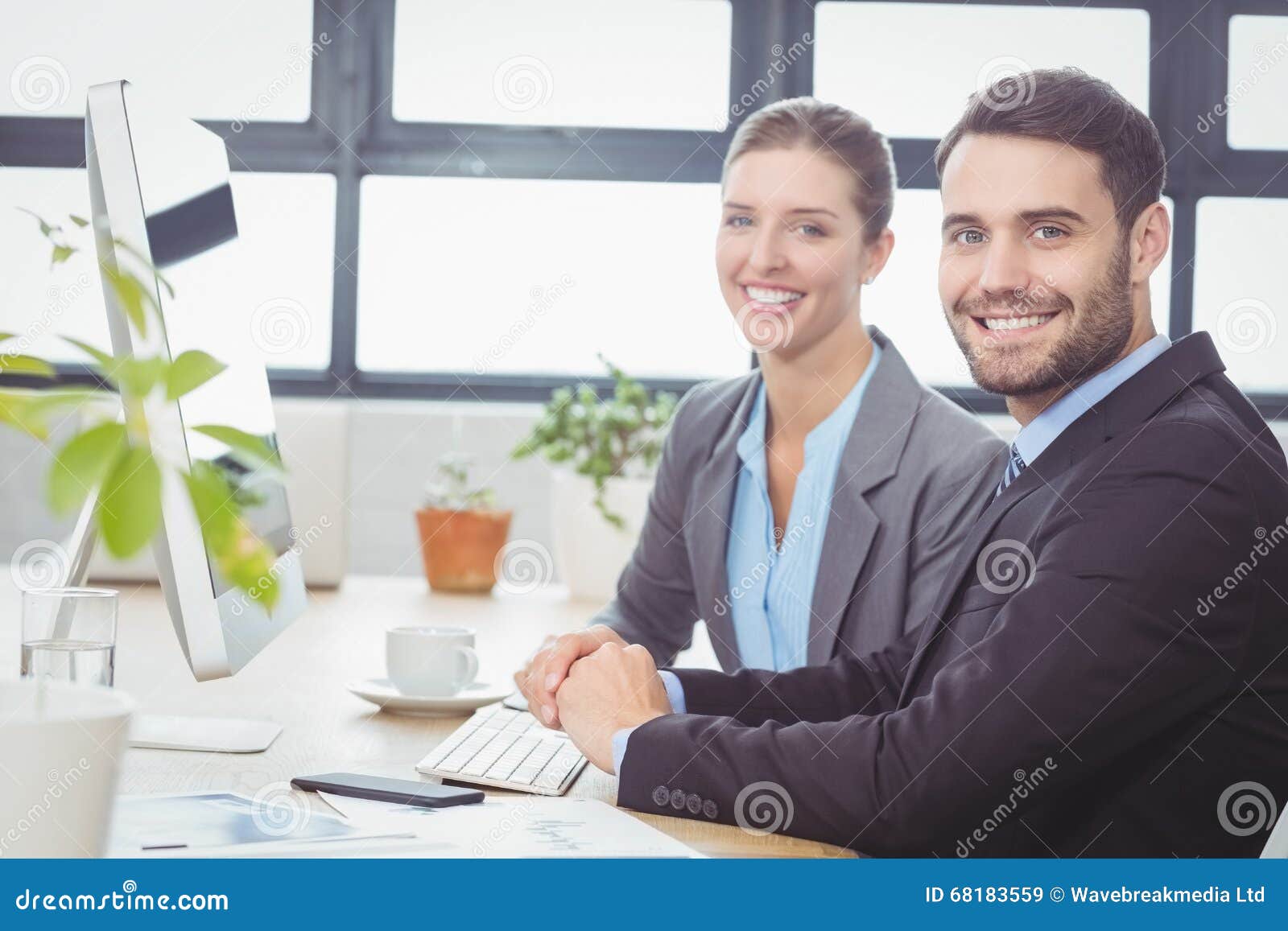 Happy Business People Working at Computer at Desk Stock Image - Image ...