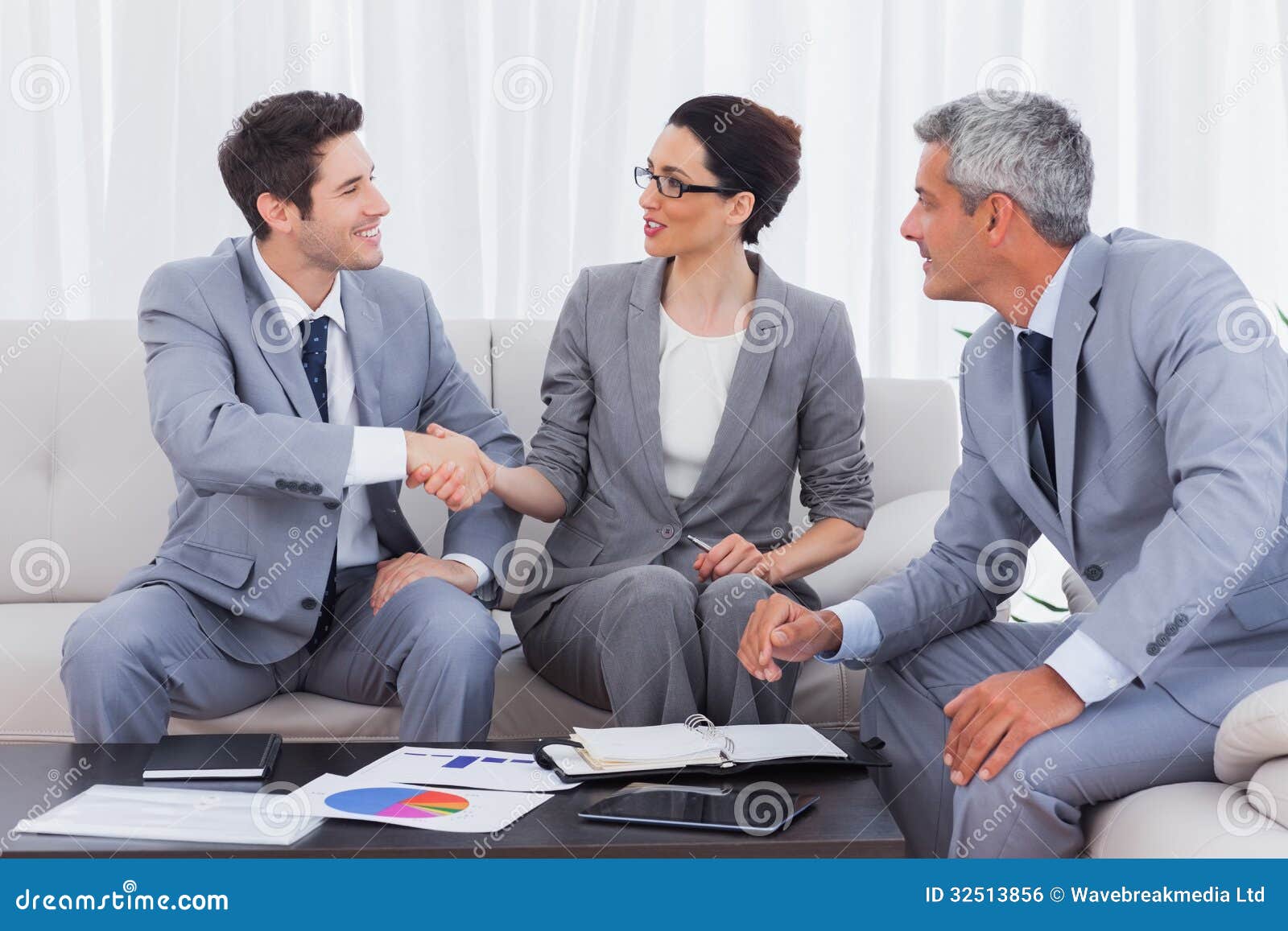 Happy Business People Working and Talking Together on Sofa Stock Photo ...