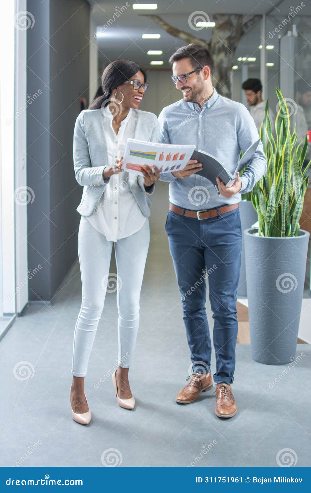 Happy Business People Working Together with Document while Walking ...