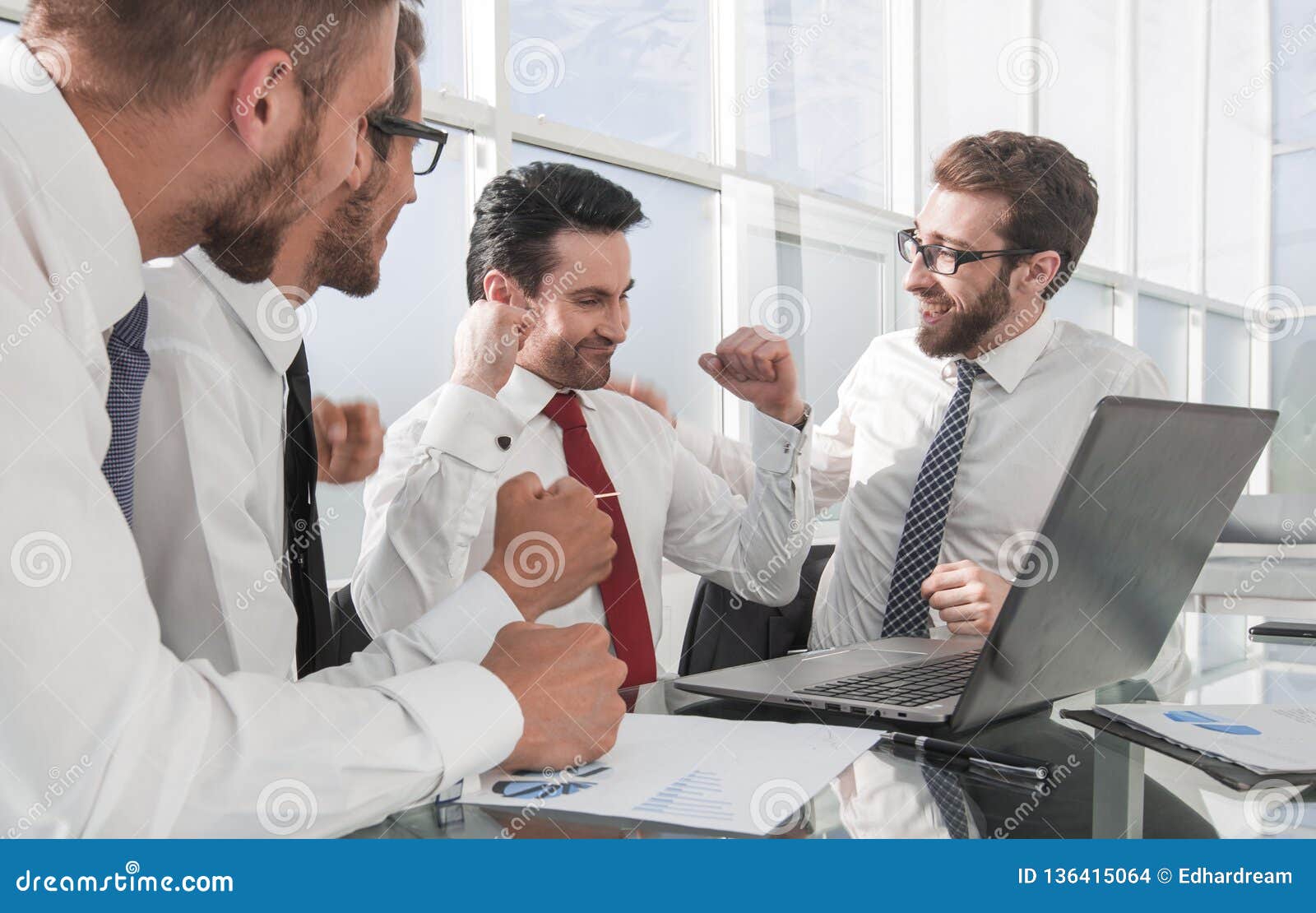 Happy Business Team Sitting at the Desk Stock Photo - Image of laptop ...