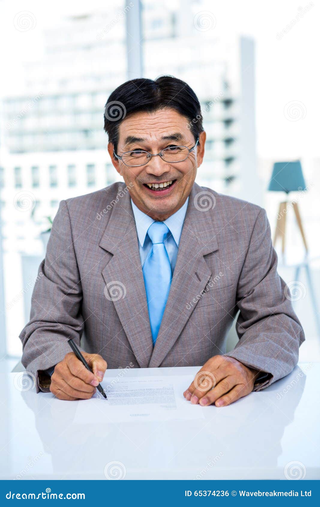 Happy Businessman on His Desk Stock Photo - Image of male, files: 65374236