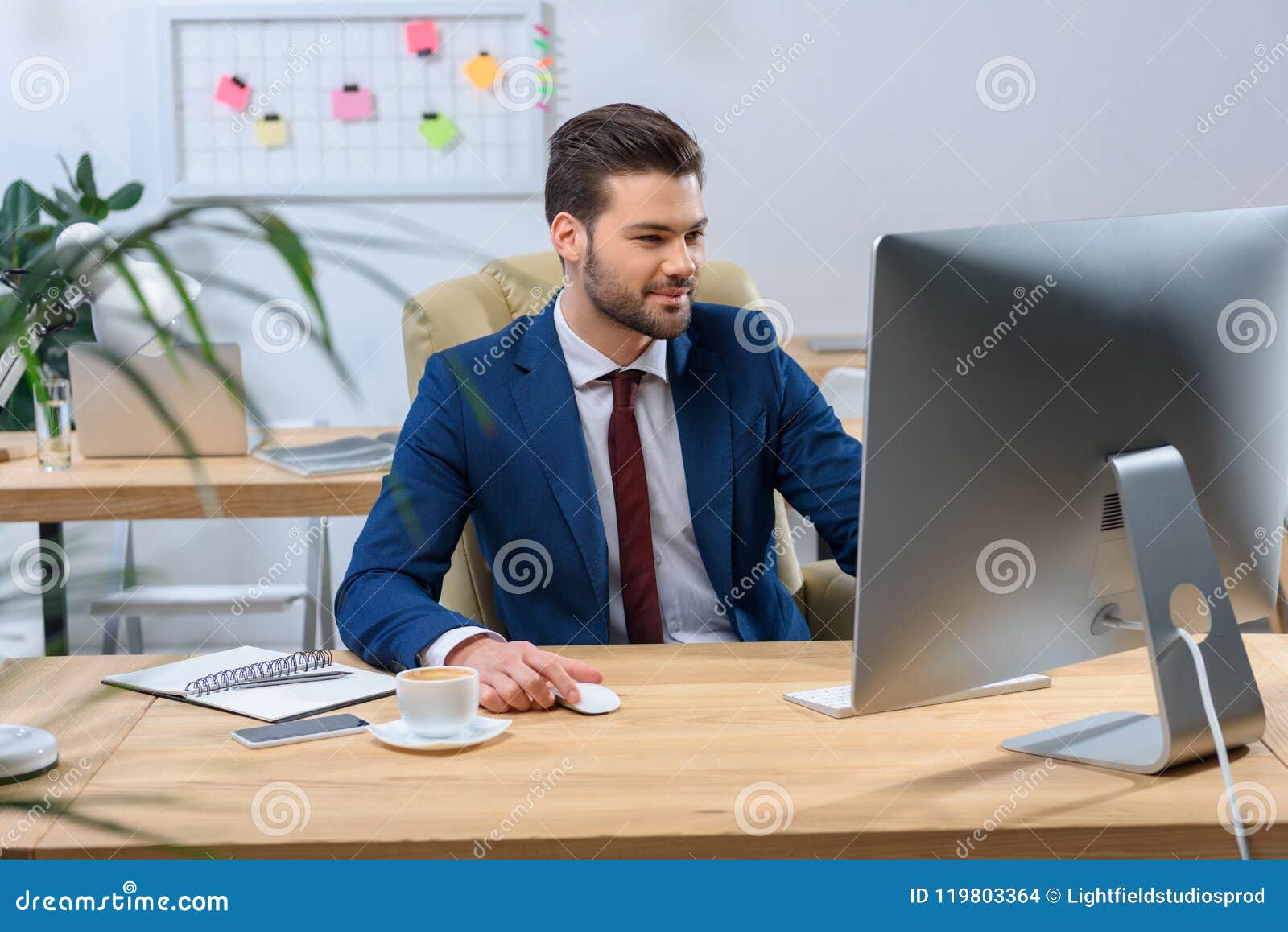 Happy Businessman Looking at Computer Stock Photo - Image of focus ...