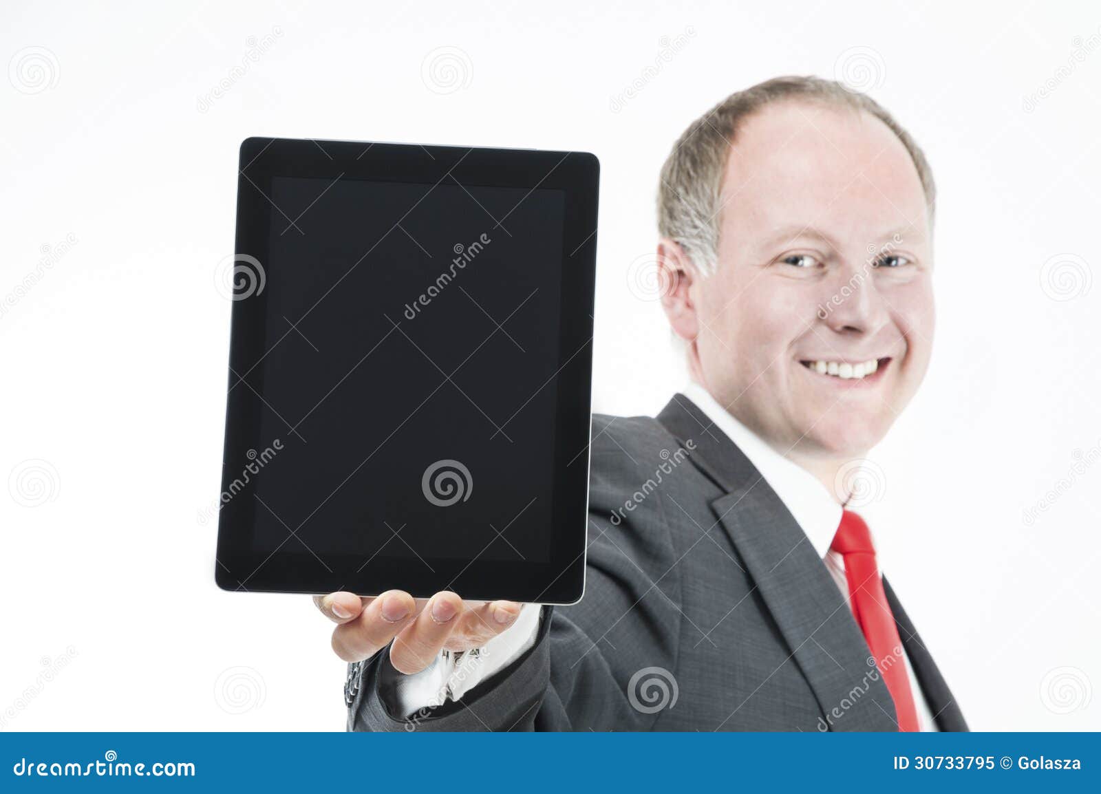 Happy Businessman Presenting Sth On Digital Tablet Stock Image