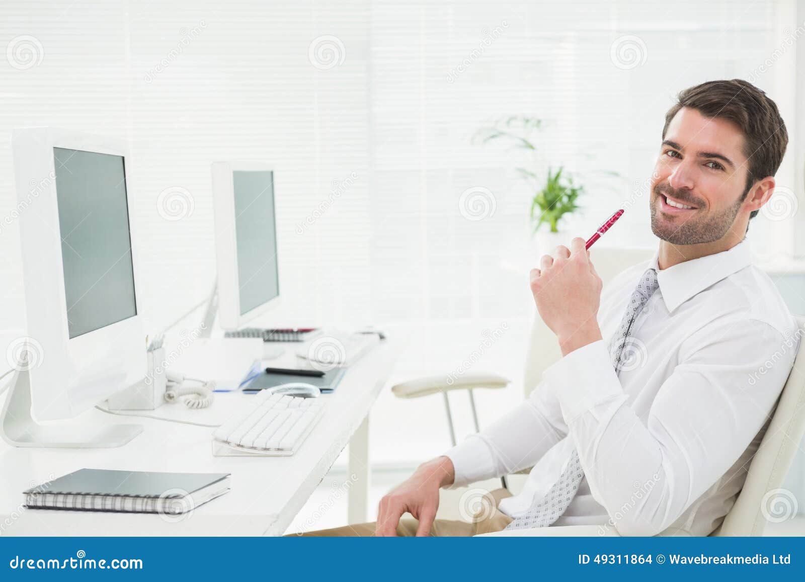 Happy Businessman Using His Computer Stock Photo - Image of classy ...