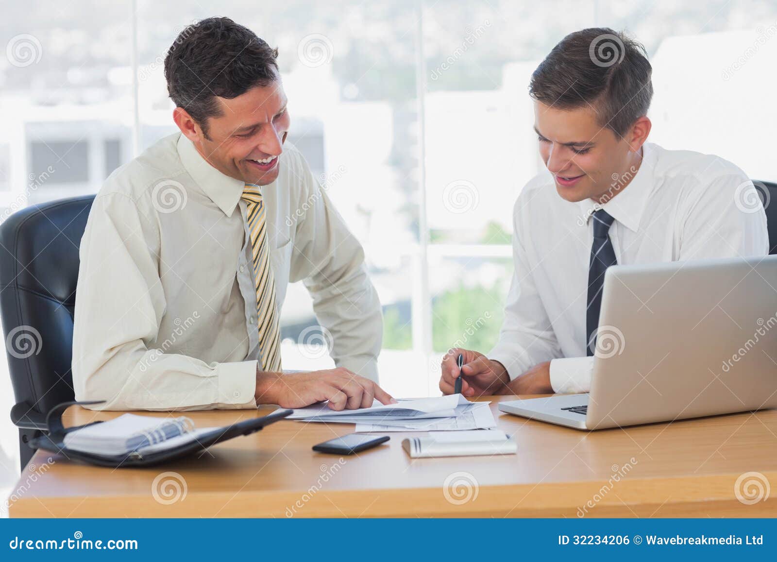 Happy Businessmen Working Together and Smiling Stock Photo - Image of ...