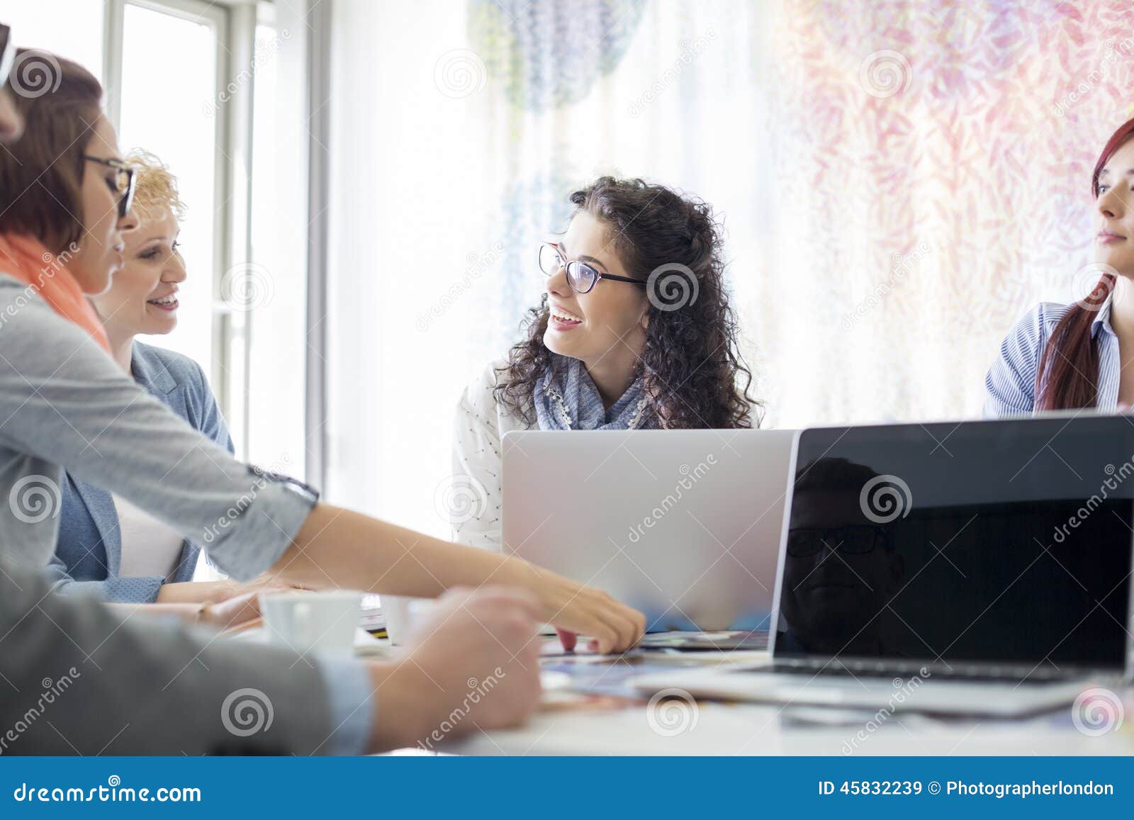 Happy Businesspeople Discussing during Meeting in Creative Office Stock ...