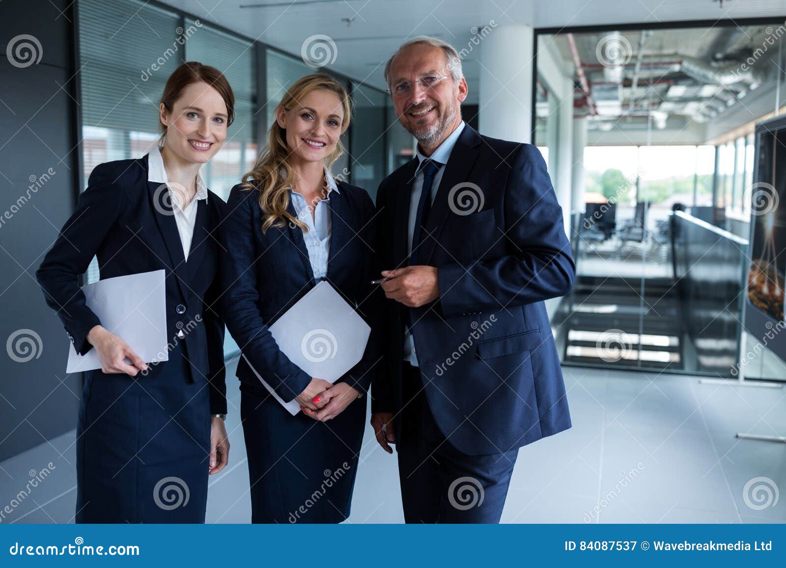Happy Businesspeople Smiling at the Office Stock Image - Image of ...