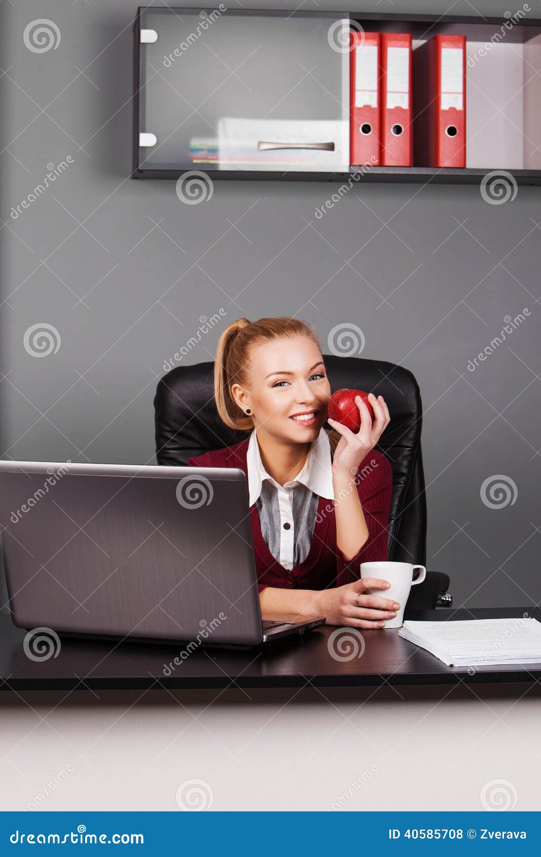 Happy Businesswoman with Apple in Office Stock Photo - Image of ...