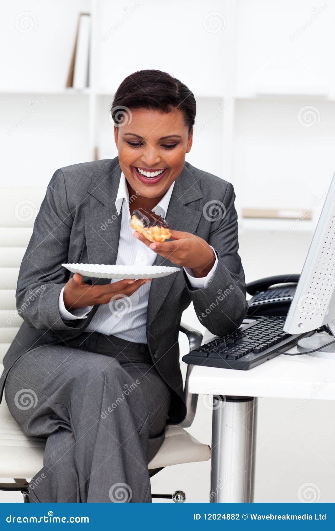 Happy Businesswoman Eating in the Office Stock Photo - Image of ...